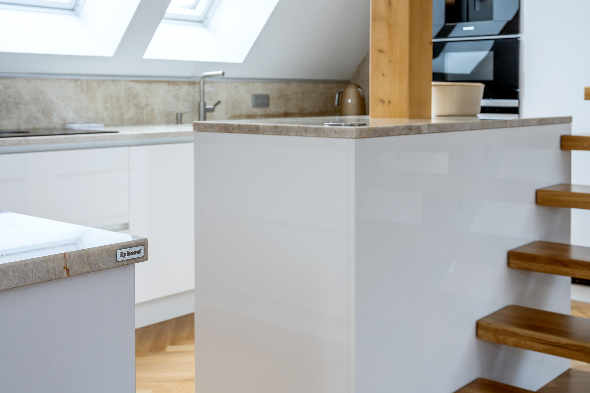A custom-made kitchen designed specifically for an atypical attic space.