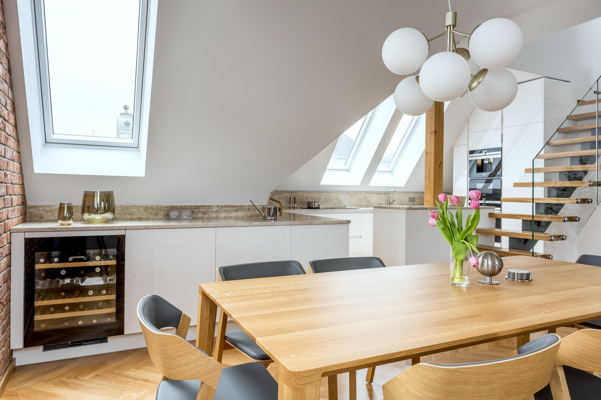 A custom-made kitchen designed specifically for an atypical attic space.