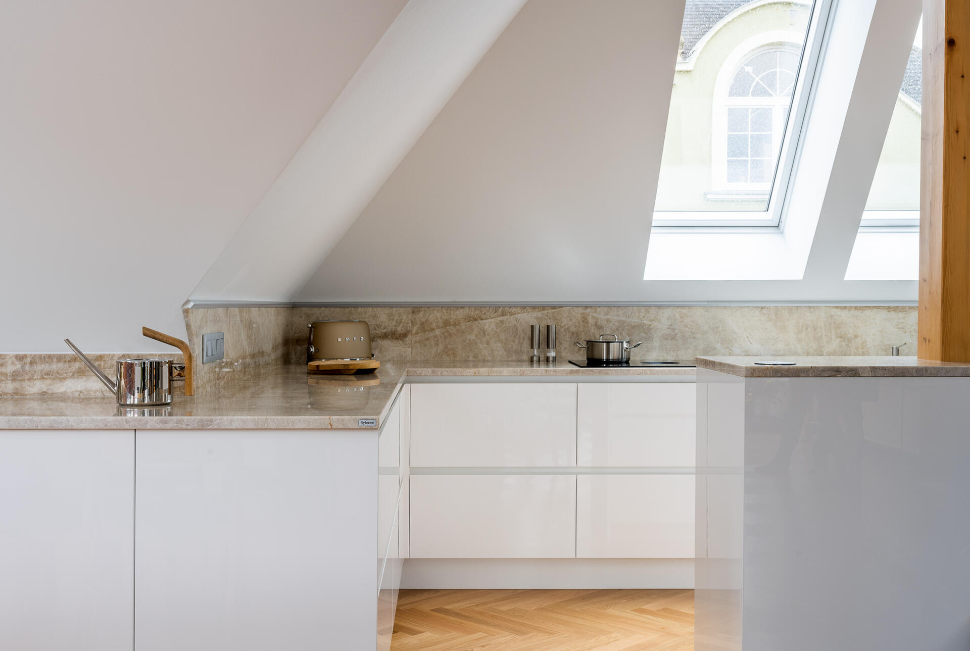A custom-made kitchen designed specifically for an atypical attic space.