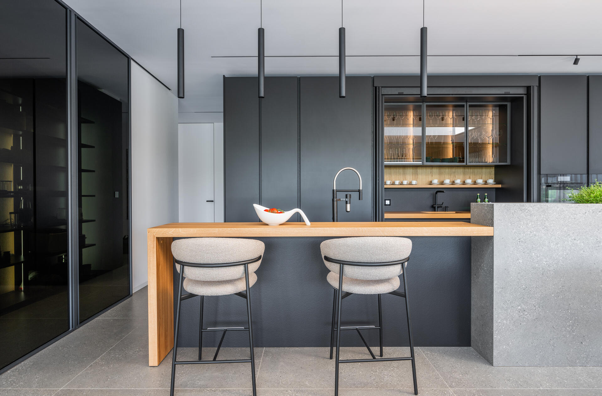 Kitchen in continuation with functional units of the entire interior