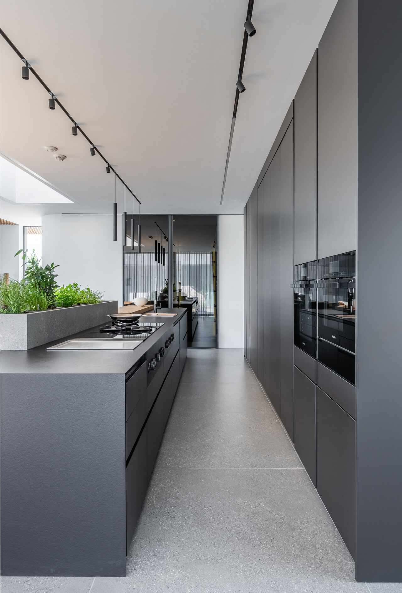 Kitchen in continuation with functional units of the entire interior